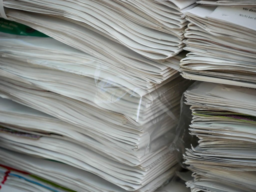 What is a defoamer and how does it work in the paper industry