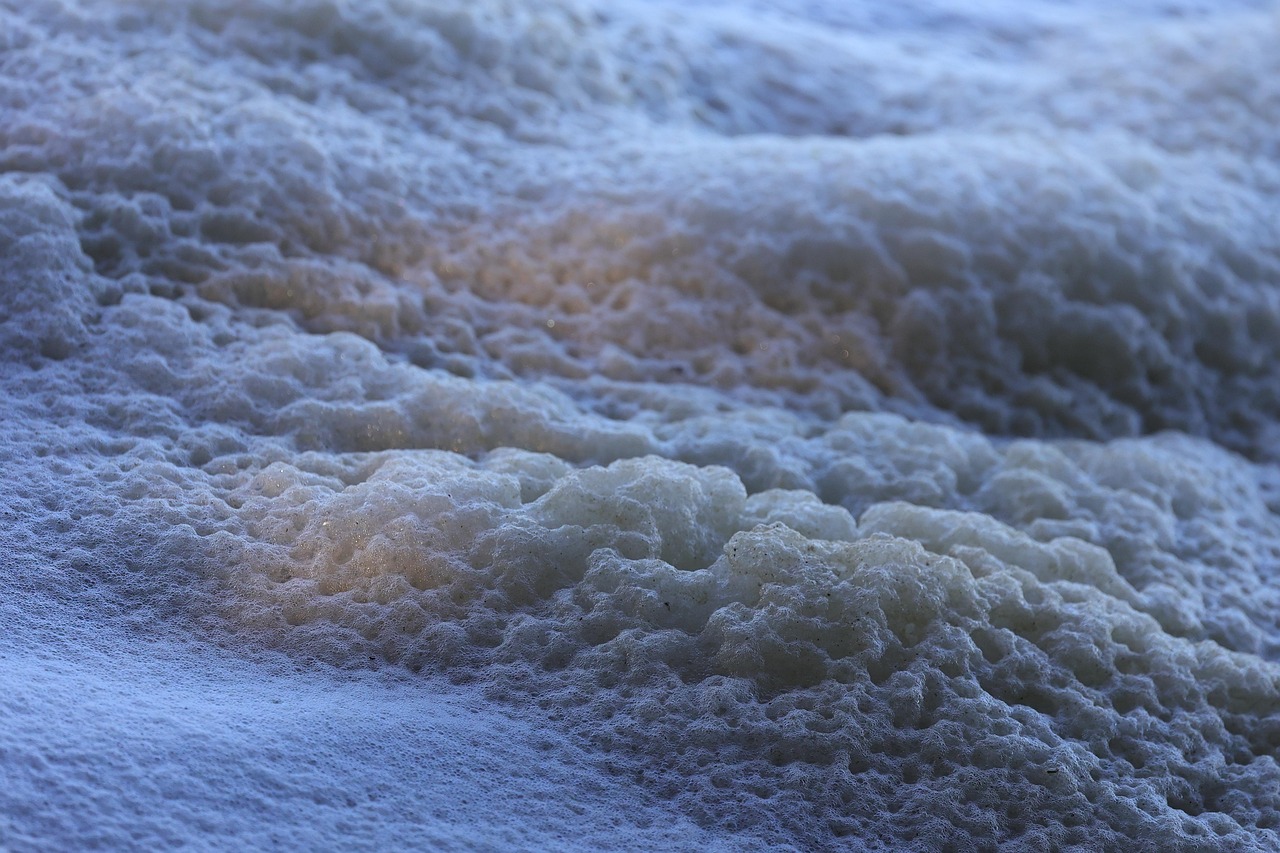 What is a defoamer and how does it work in the paper industry